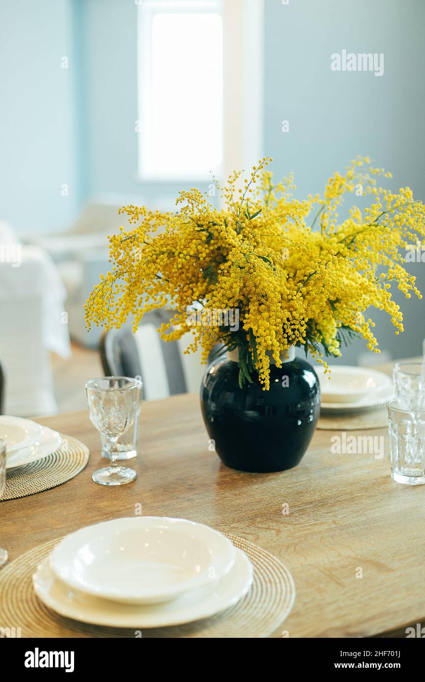 Wooden table with empty plates and glasses. Festive Easter table ...