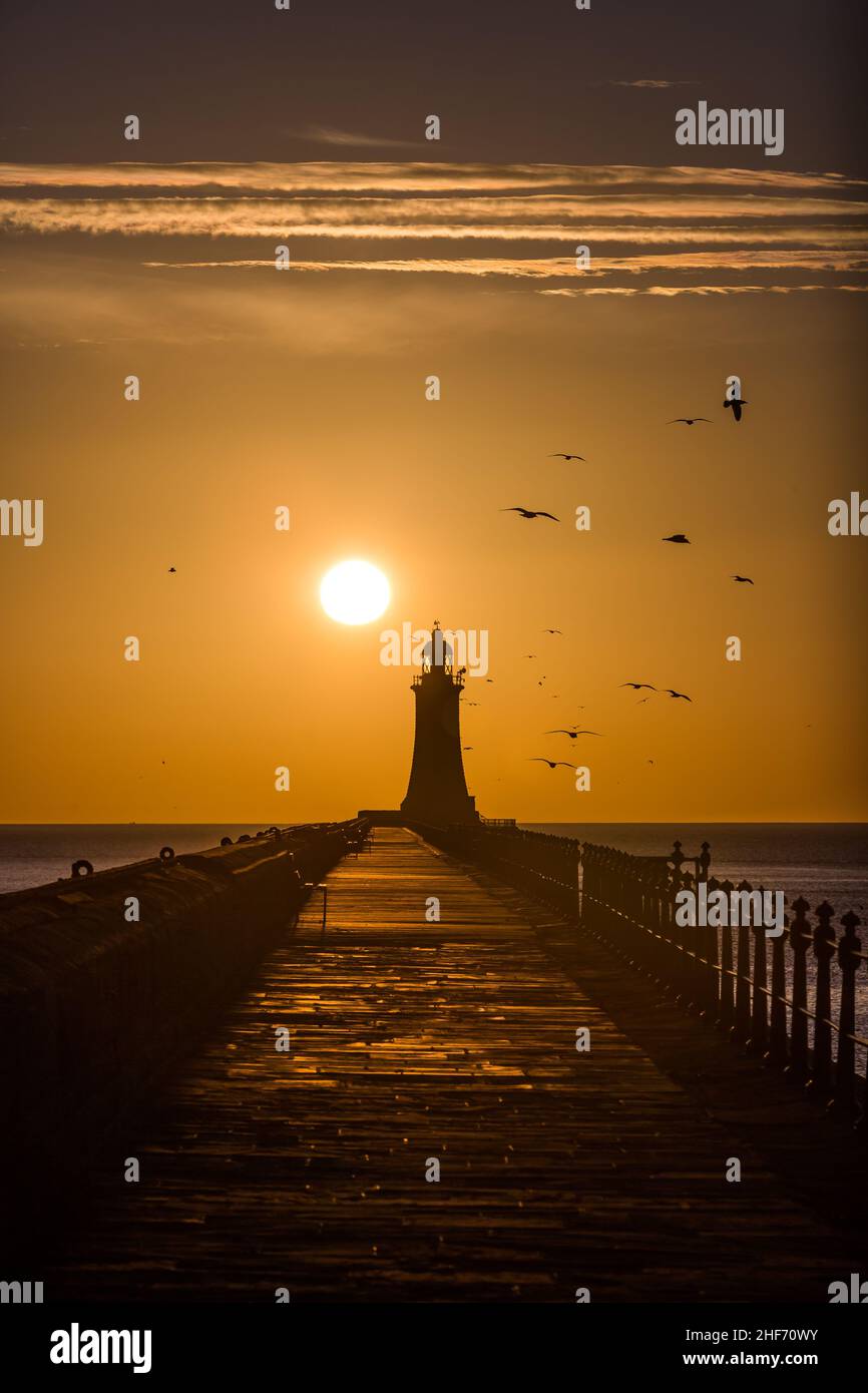 Tynemouth Pier and the Lighthouse with a beautiful vibrant sunrise ...