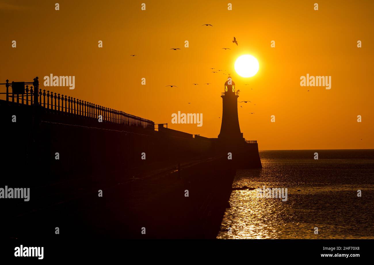 Tynemouth Pier and the Lighthouse with a beautiful vibrant sunrise ...