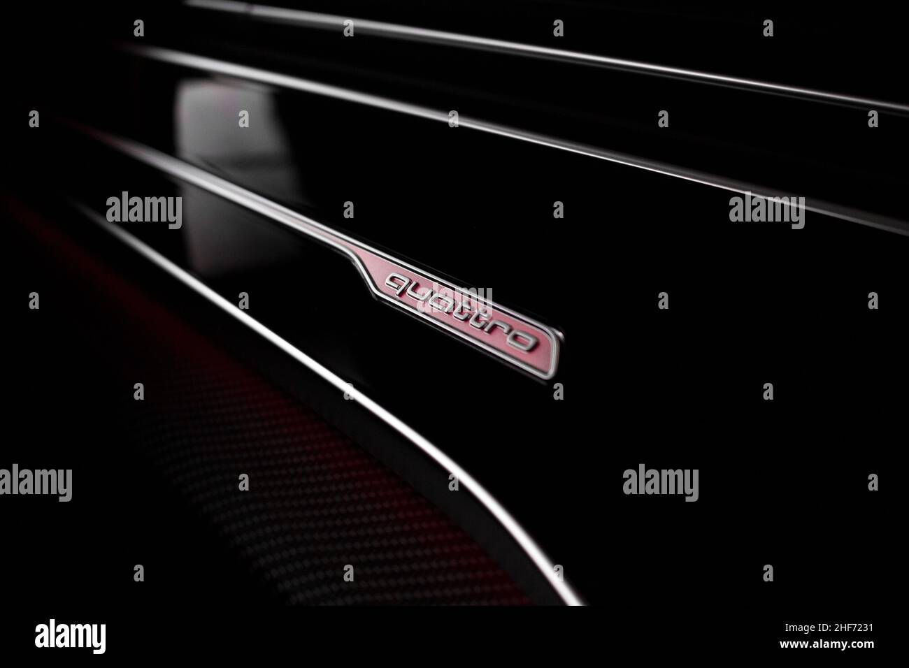 The Chrome Quattro Dashboard Badge On Piano Black Background With Red ...