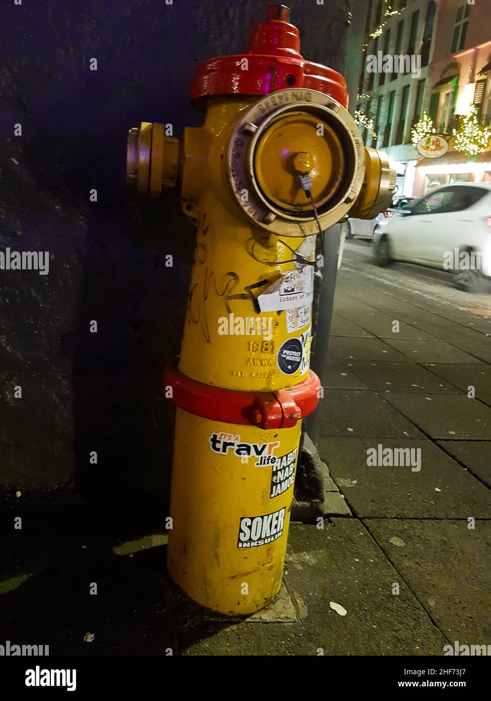 Red and yellow fire hydrant in the city centre of Reykjavik, Iceland ...