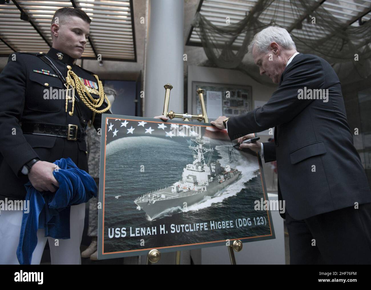 Secretary of the Navy (SECNAV) Ray Mabus signs a graphic representation ...