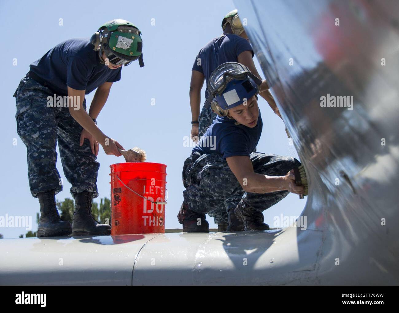 Sea Cadets of the Naval Sea Cadet Corps (NSCC) wash the static display ...