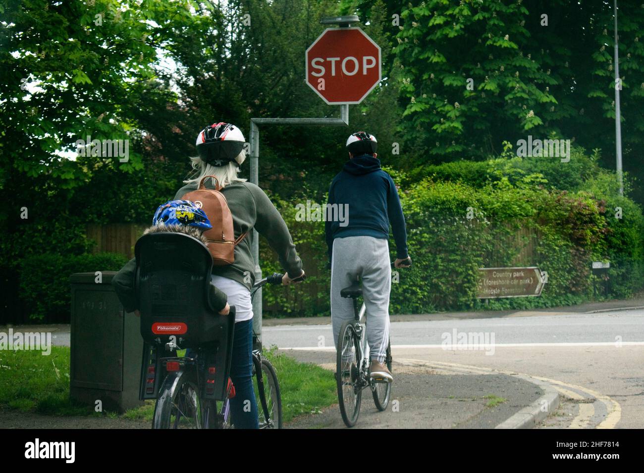British STOP road sign with stop car waiting for safety before turning ...