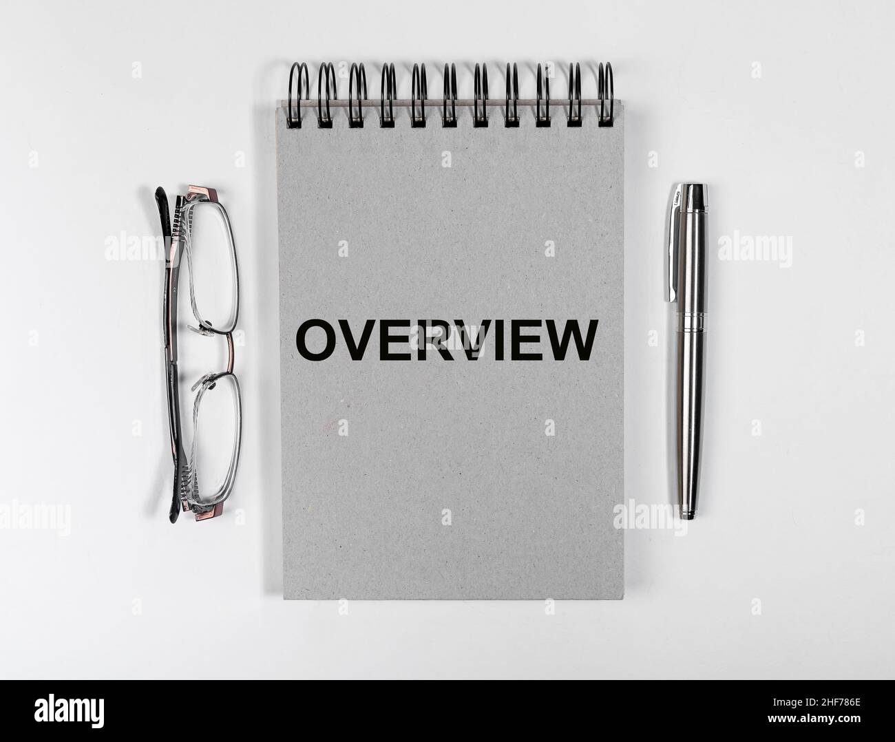 Overview word. Summary and recap concept. Notebook, glasses and pen ...