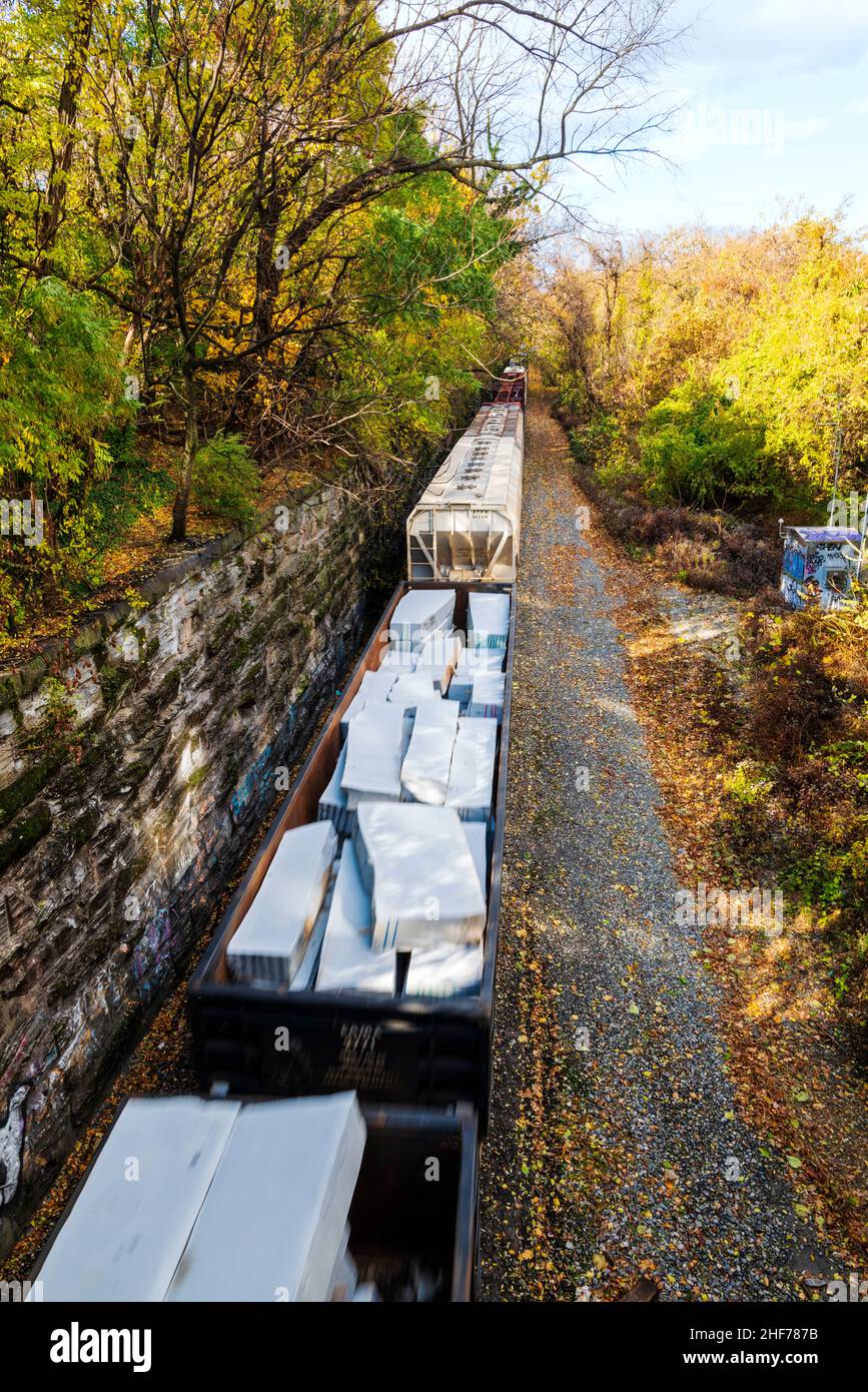 Overhead view of freight train moving down railroad tracks through ...