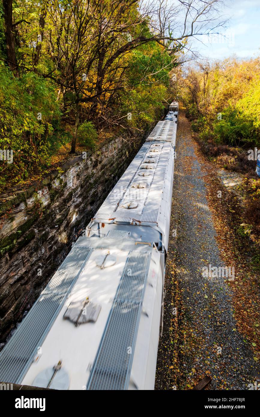 Overhead view of freight train moving down railroad tracks through ...