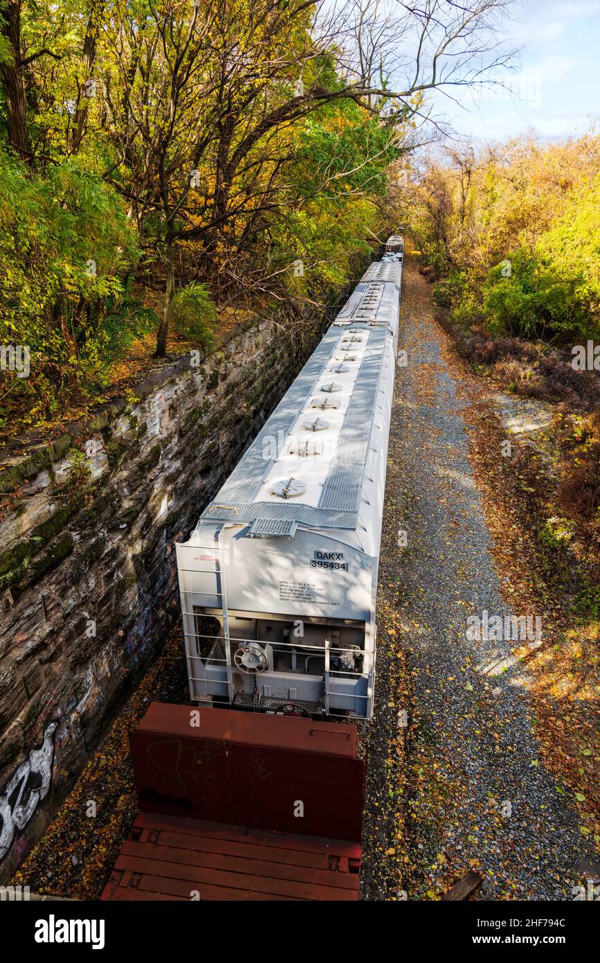 Overhead view of freight train moving down railroad tracks through ...