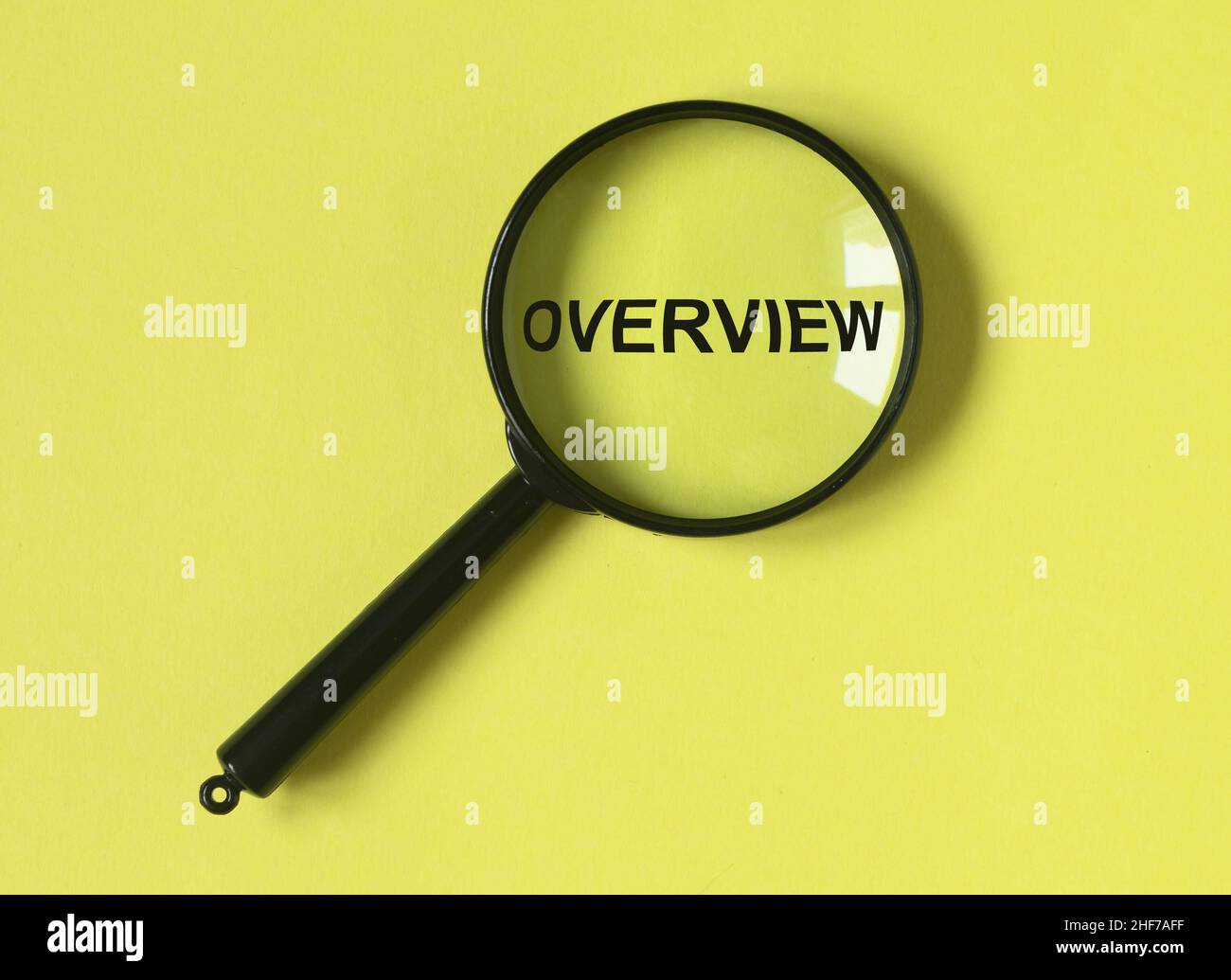 Overview word. Summary and recap concept. Magnifying glass on yellow ...