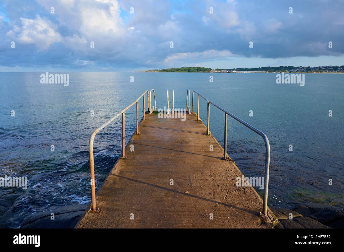 Stone beach, bathing jetty, bathing place, clouds, sea, morning, summer ...