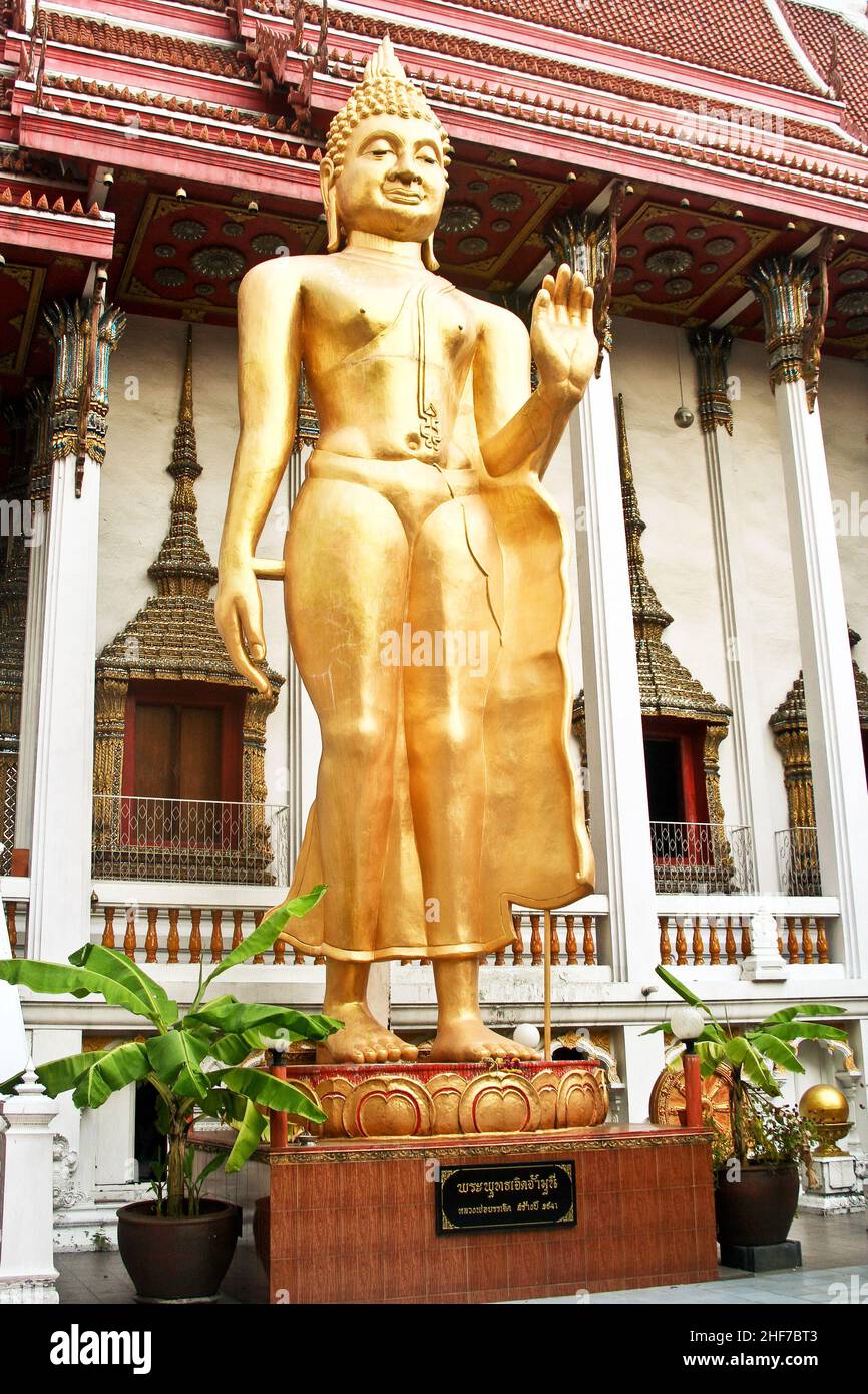standing Buddah in a temple in Bangkok is giving a handsign Stock Photo ...