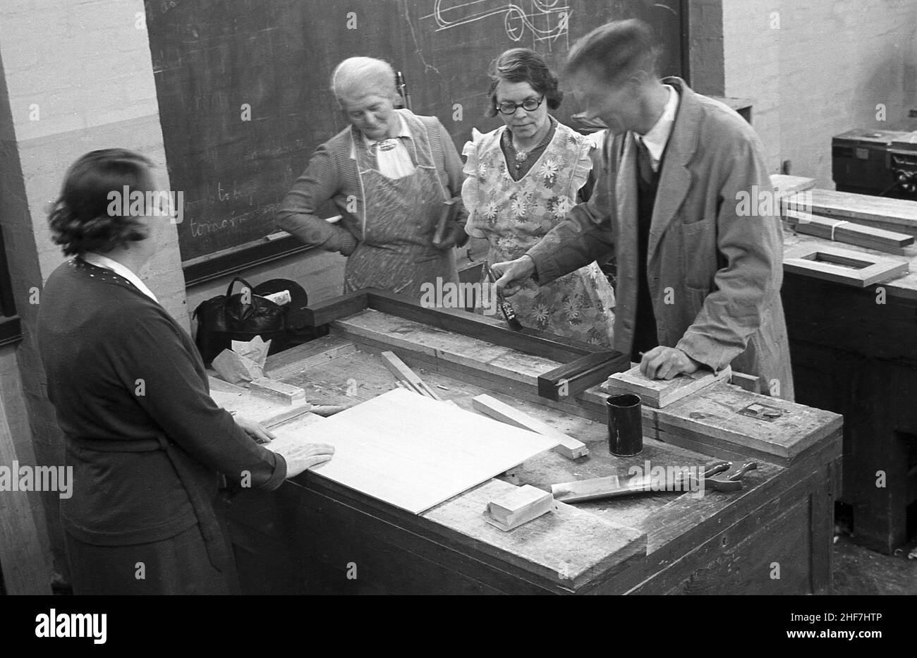 1940s, historical, ladies at a wood-working class, with male instructor ...
