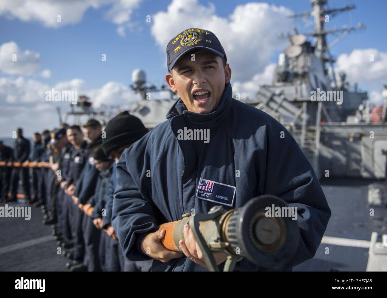 Seaman acts as nozzleman during a firefighting exercise aboard USS ...