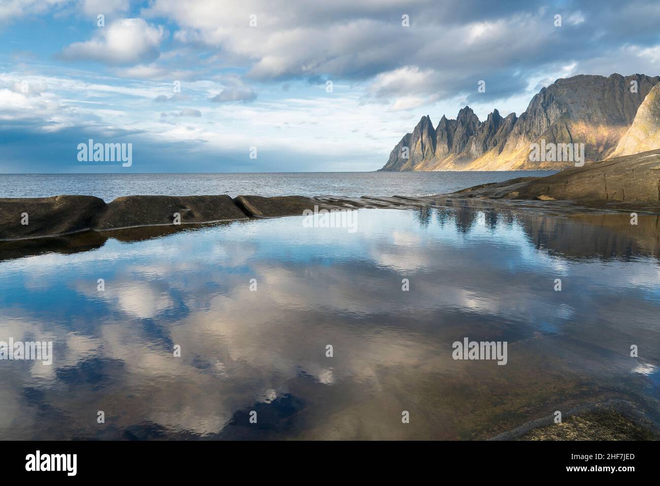 Norway, Senja, Skaland, Tungeneset, mirroring sky and clouds Stock ...