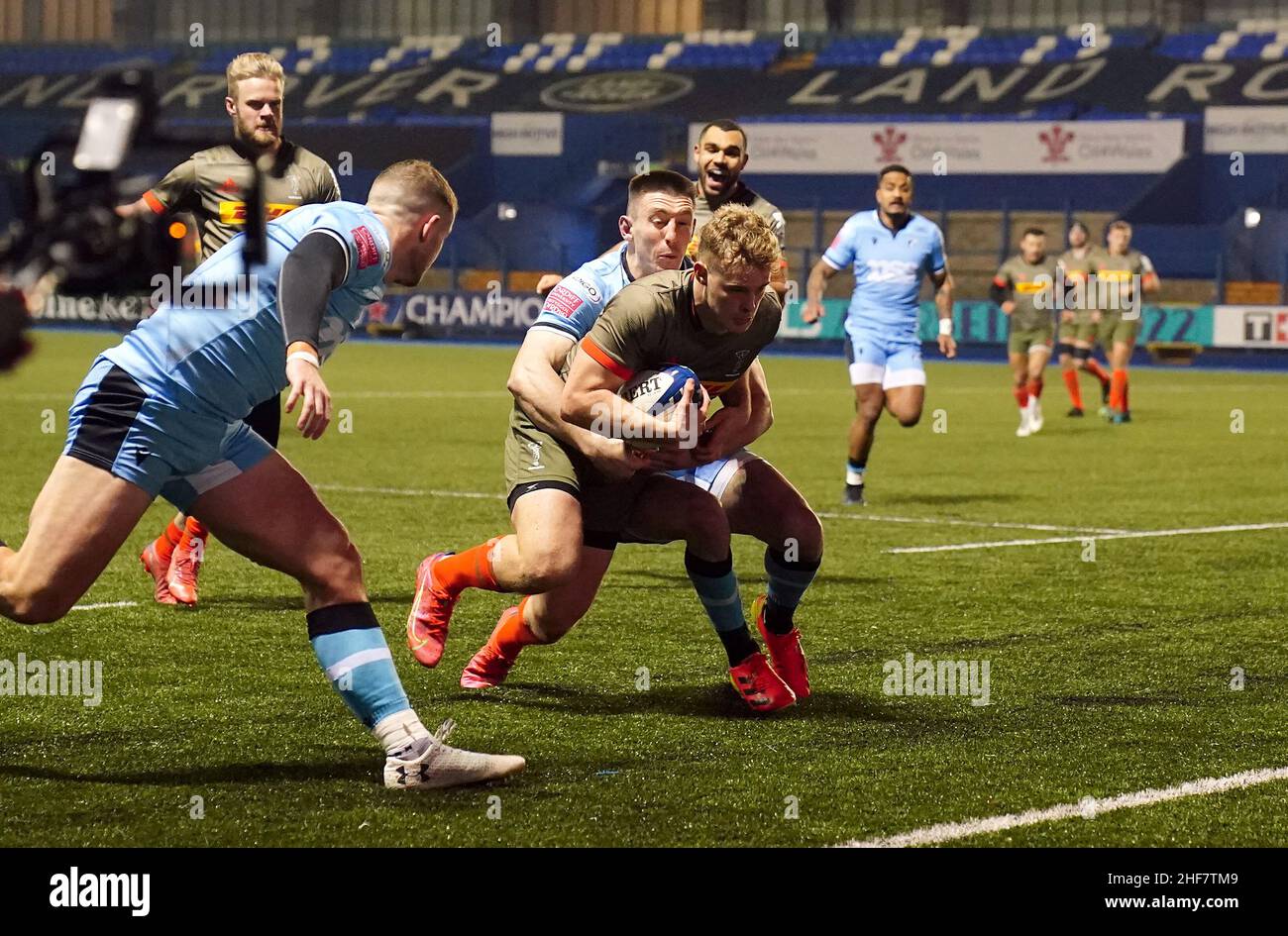 Harlequins' Louis Lynagh goes over to score a try during the Heineken ...