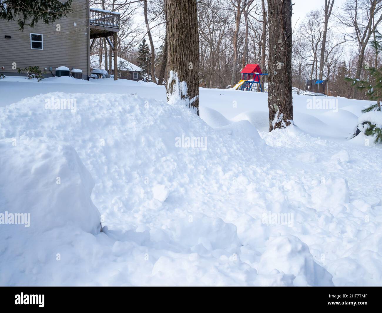 gardens and backyards covered with snow after the snow storm in winter ...