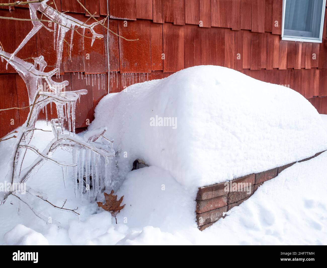 backyard covered with mounds of snow after the snow storm in winter ...