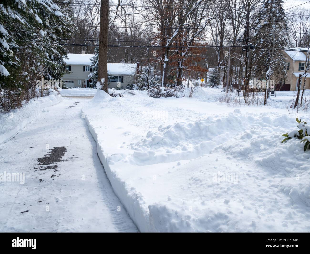 cleaned driveway after the snow storm Stock Photo - Alamy