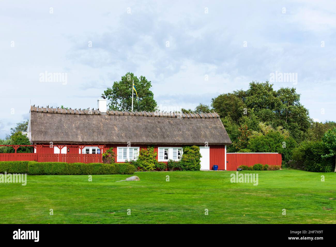 Falkenberg, wooden house, Swedish flag in Hallands län, Sweden Stock ...