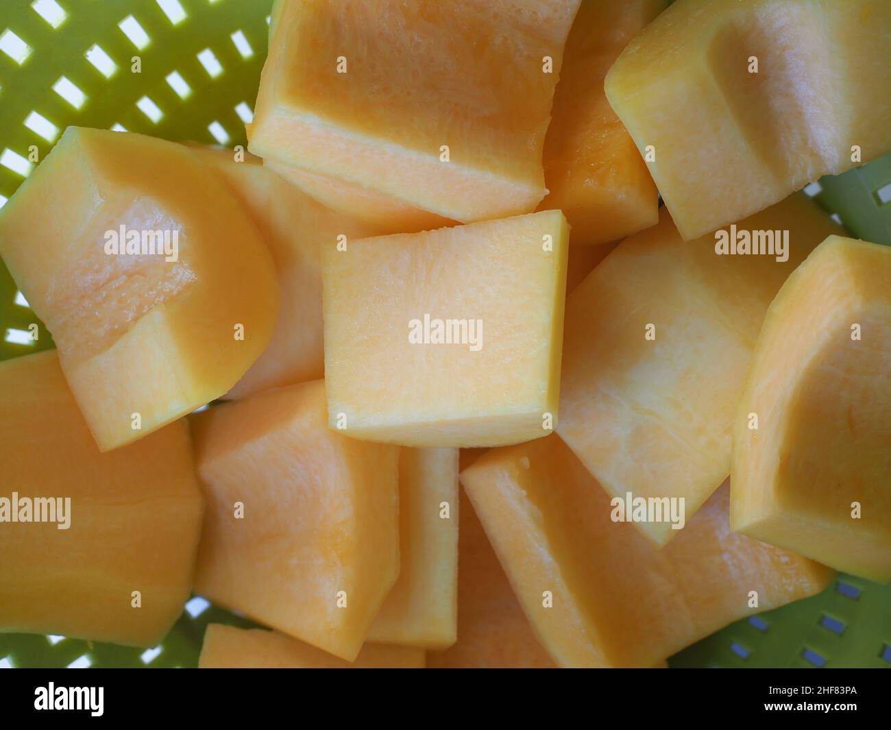 diced pumpkin vegetable useful as a food background Stock Photo - Alamy