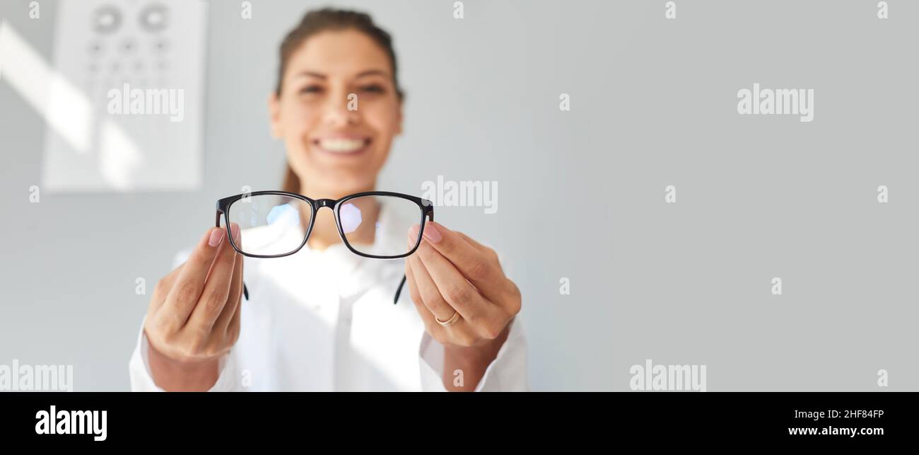 Copy space banner background with happy optometrist giving you new ...