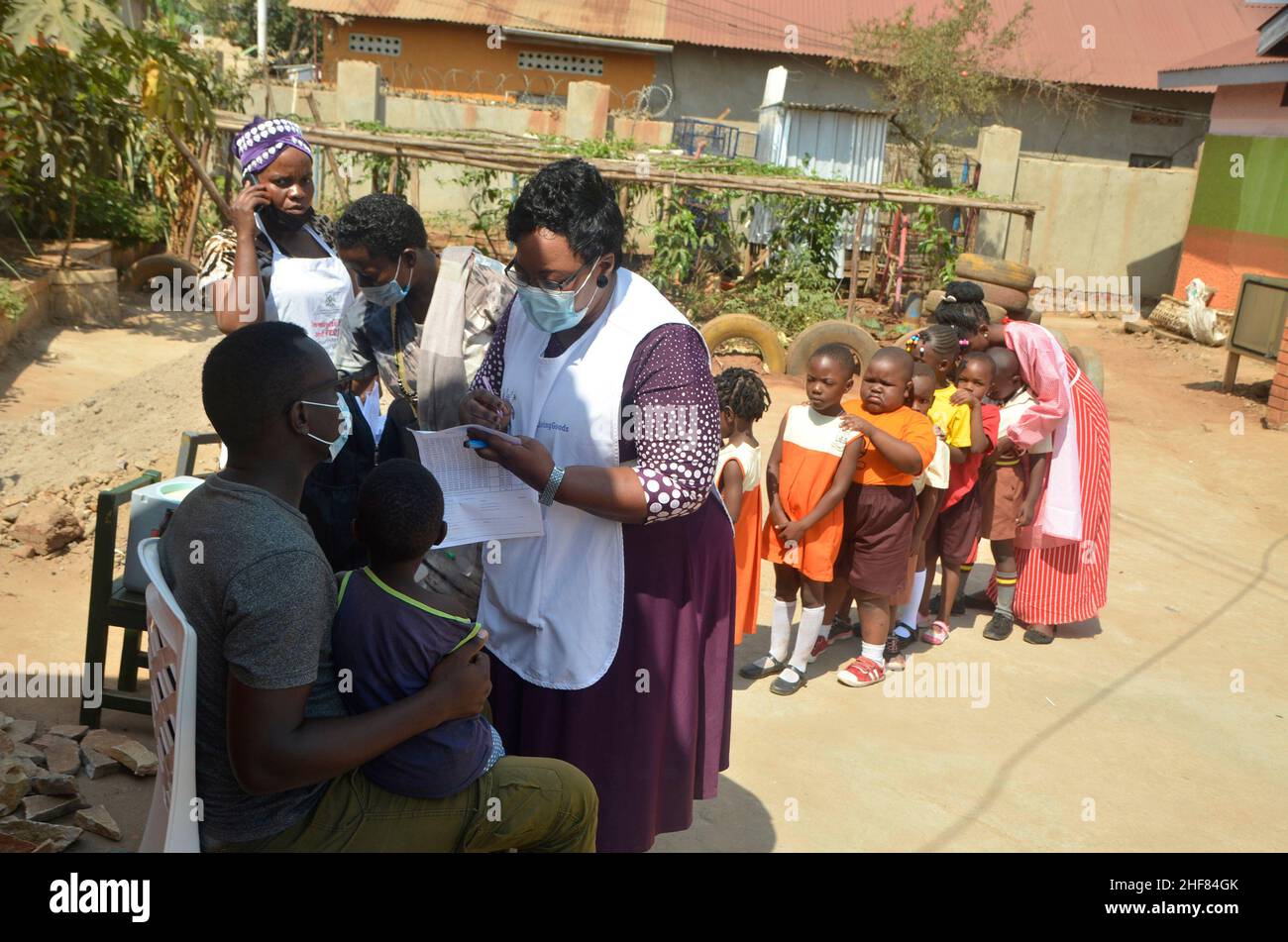 Kampala, Uganda. 14th Jan, 2022. Children line up to receive polio ...