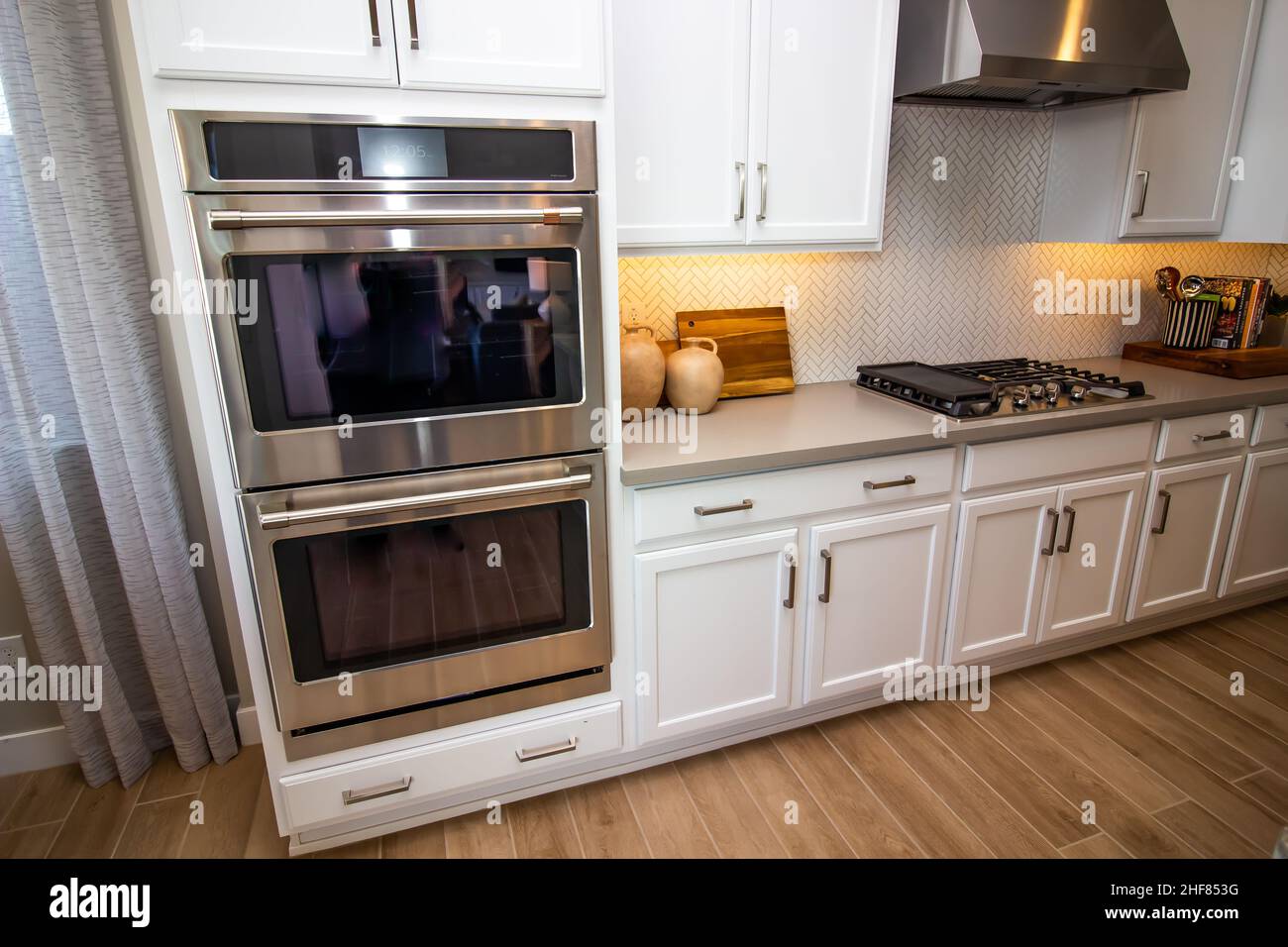 Modern Kitchen With Stainless Steel Ovens, Gas Cook Top And Counter Top ...