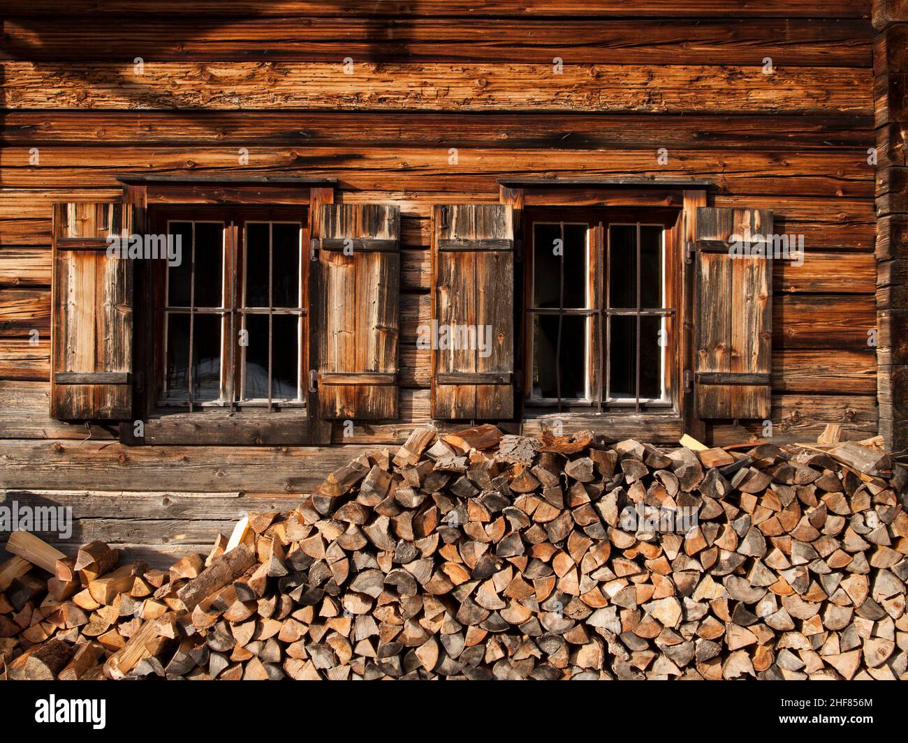 Wood in front of the hut, mountain hut Stock Photo - Alamy