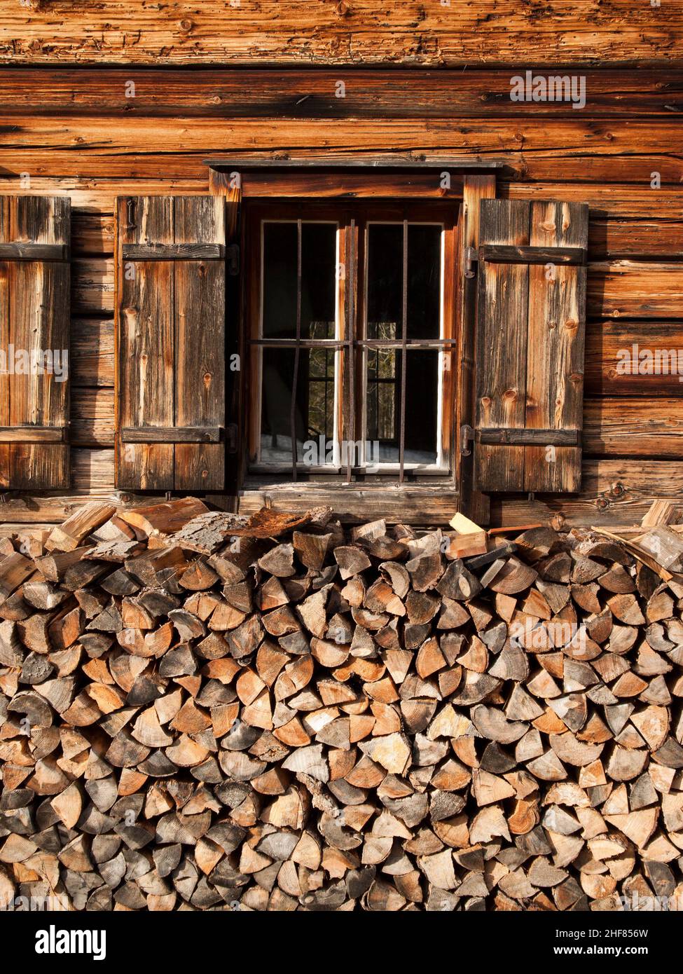 Wood in front of the hut, mountain hut Stock Photo - Alamy