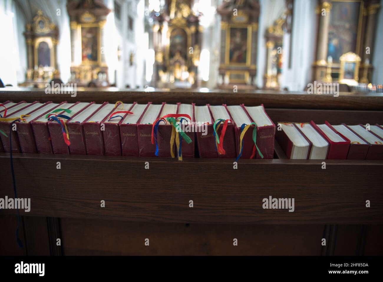 Prayer books, church interior Stock Photo - Alamy