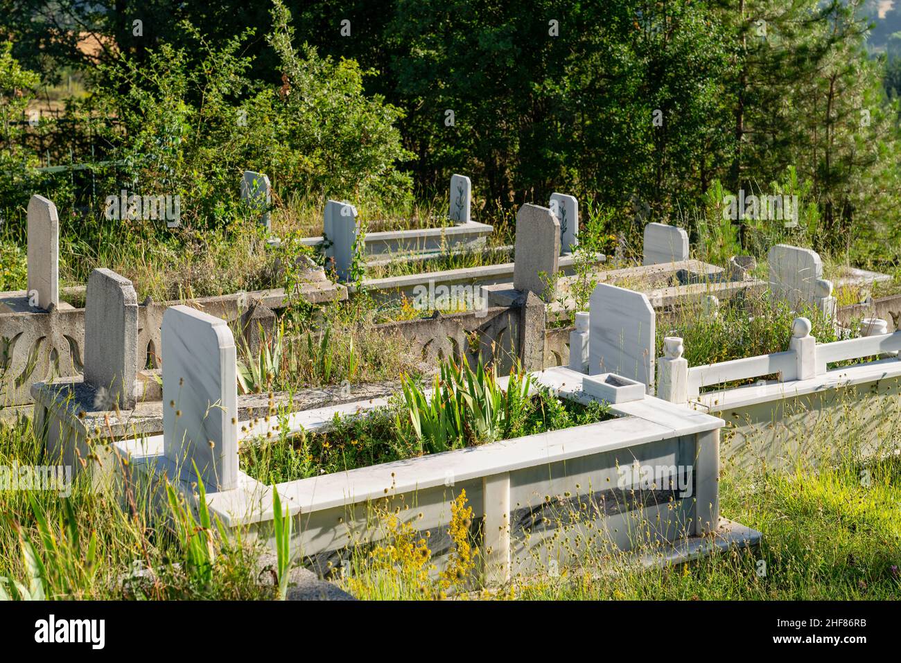 Country Muslim cemetery with green plants in Turkey Stock Photo - Alamy