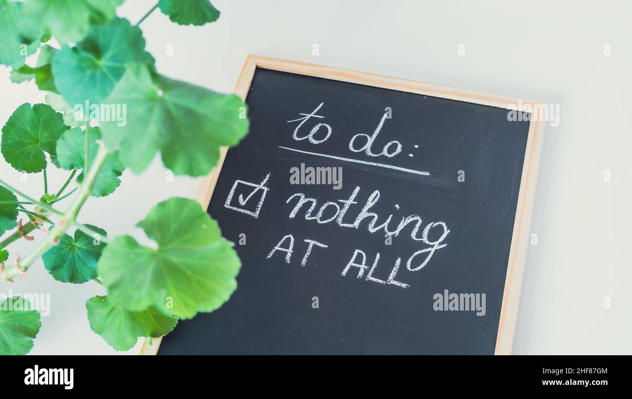 Chalkboard sign with to do list and text nothing at all, framed by ...