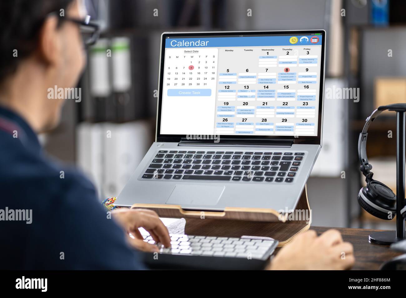 Man Using Agenda Calendar Schedule App On Laptop Computer Stock Photo ...