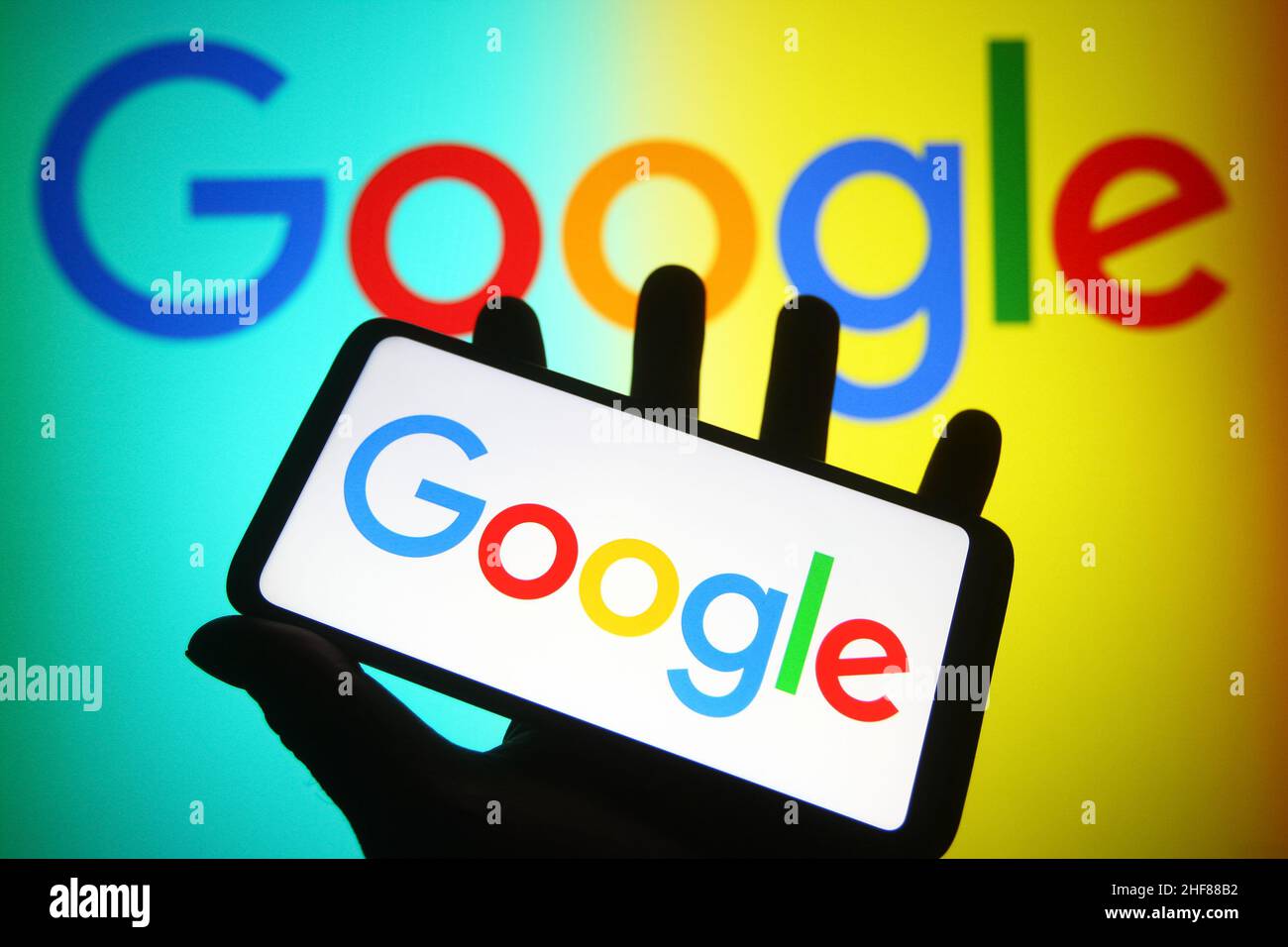 In this photo illustration, a Google logo is seen on a smartphone Stock ...