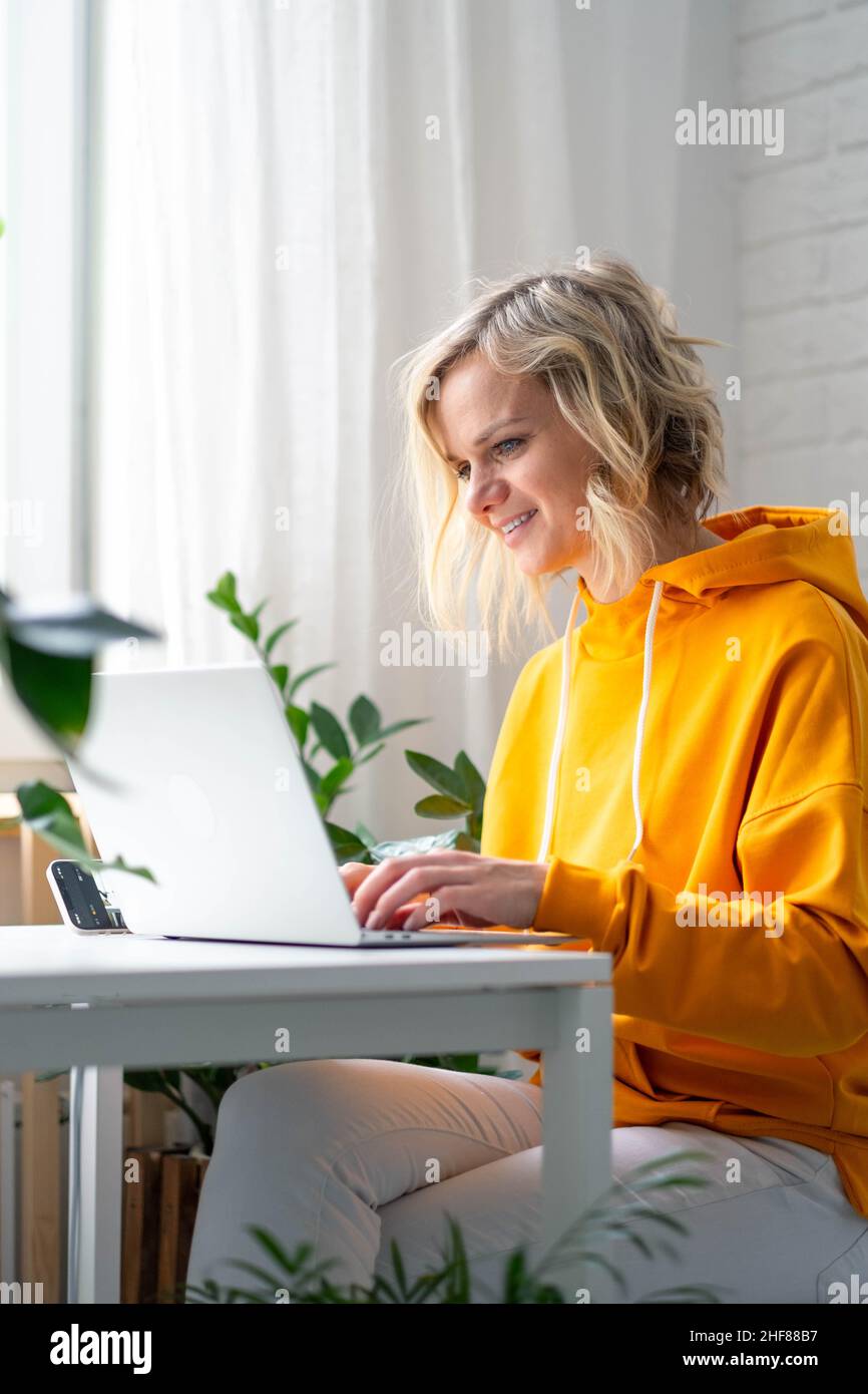 Happy woman girl Using computer laptop working office work remotely ...