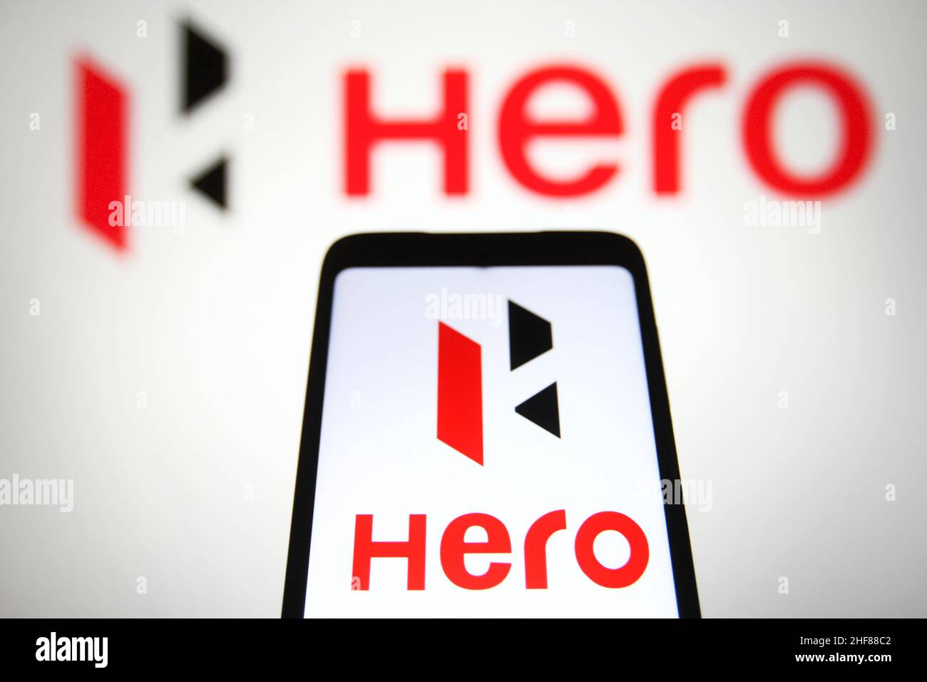 In this photo illustration, a Hero MotoCorp Limited logo is seen on a ...