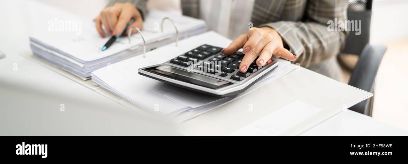 Accountant Calculating Financial Budget And Invoice In Office Stock ...