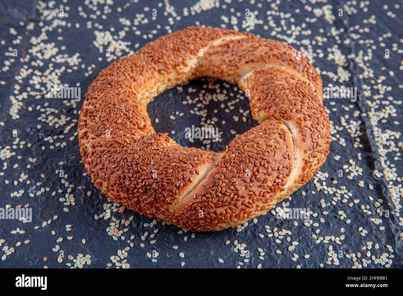 Sesame seeds and simit on a black background. Turkish Bagels Stock ...