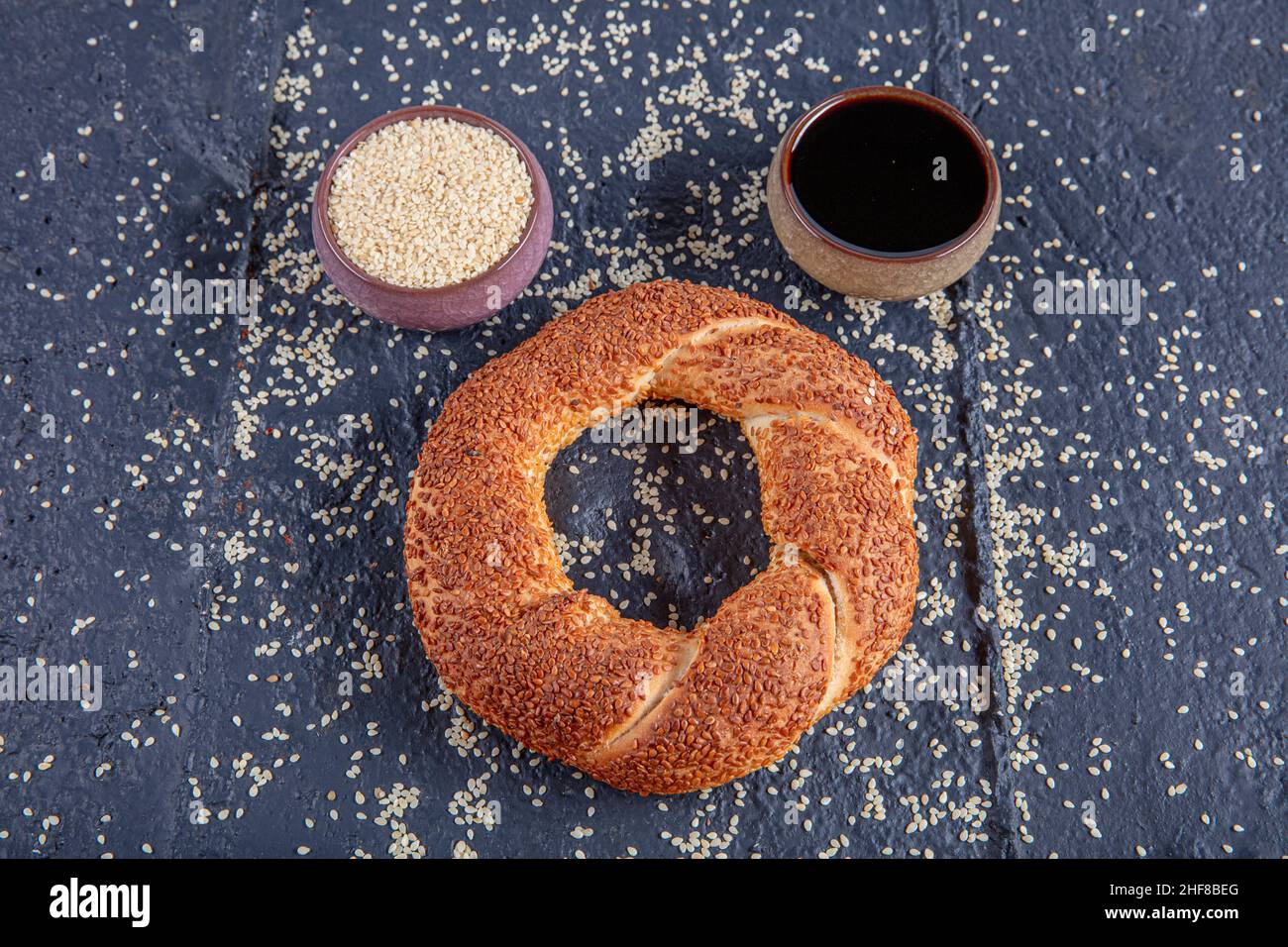 Sesame seeds and simit on a black background. Turkish Bagels Stock ...