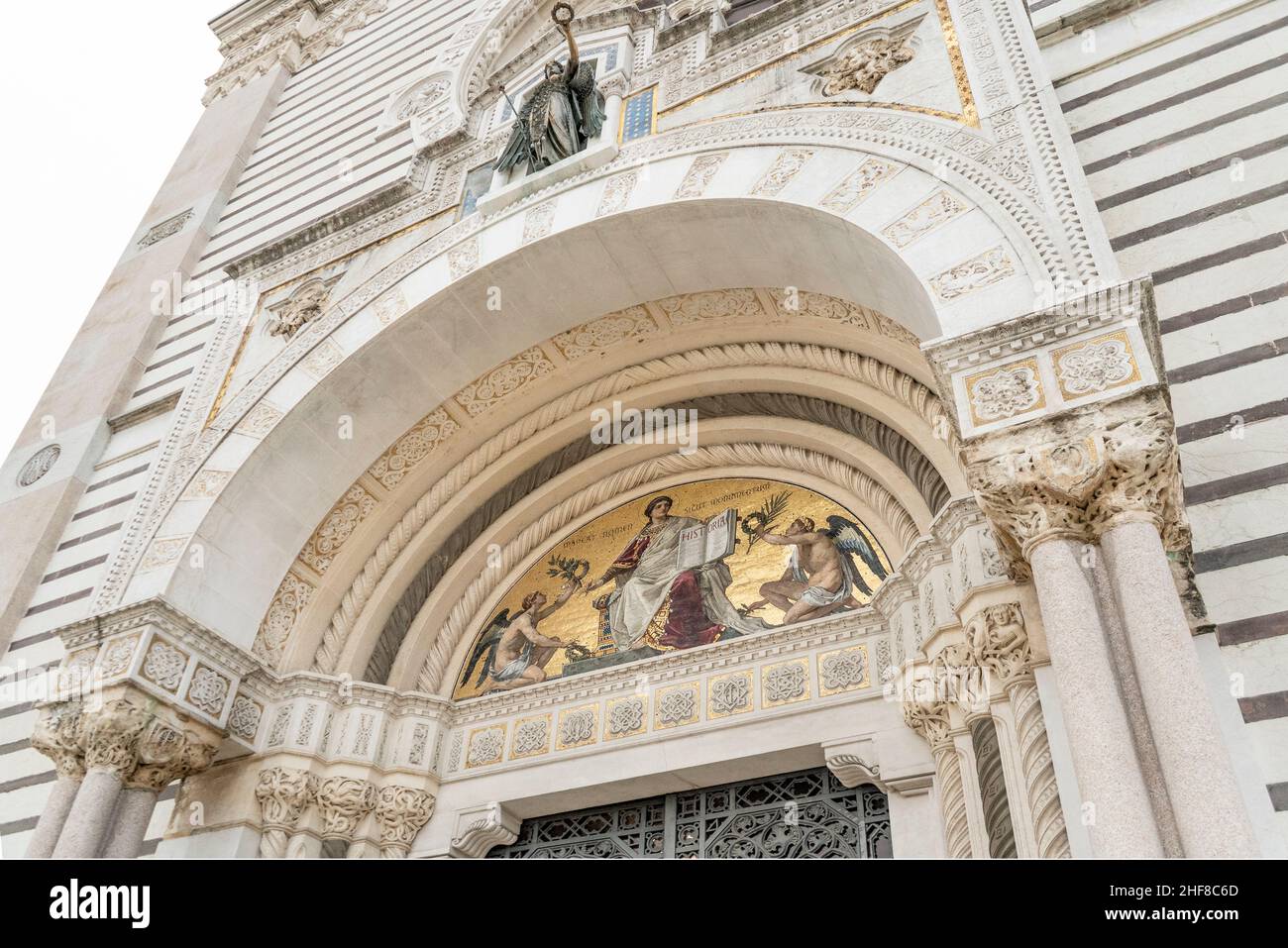 A mosaic lunette above the entrance of the "Famedio", a Hall of Fame ...