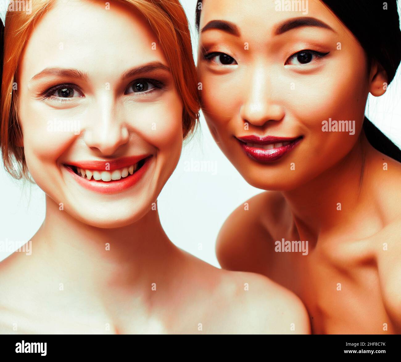 different nation woman: caucasian and asian together isolated on white ...