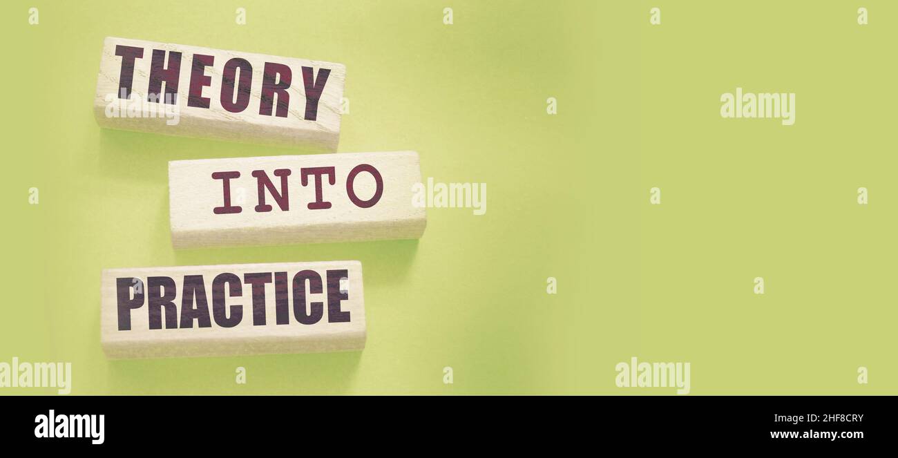 Theory into practice words written on wooden blocks. Education or ...