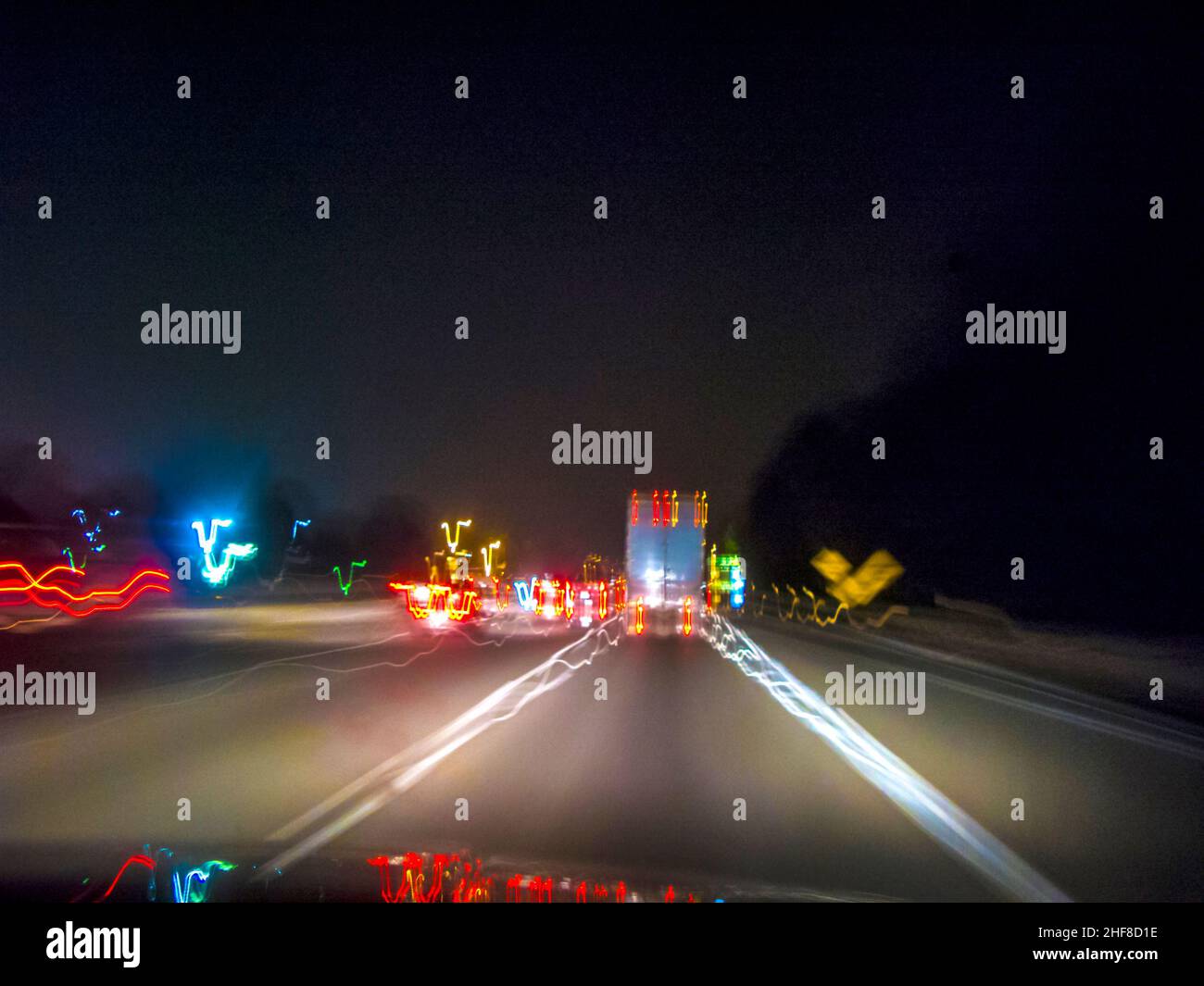 view by night and rain through the front window of the car Stock Photo ...