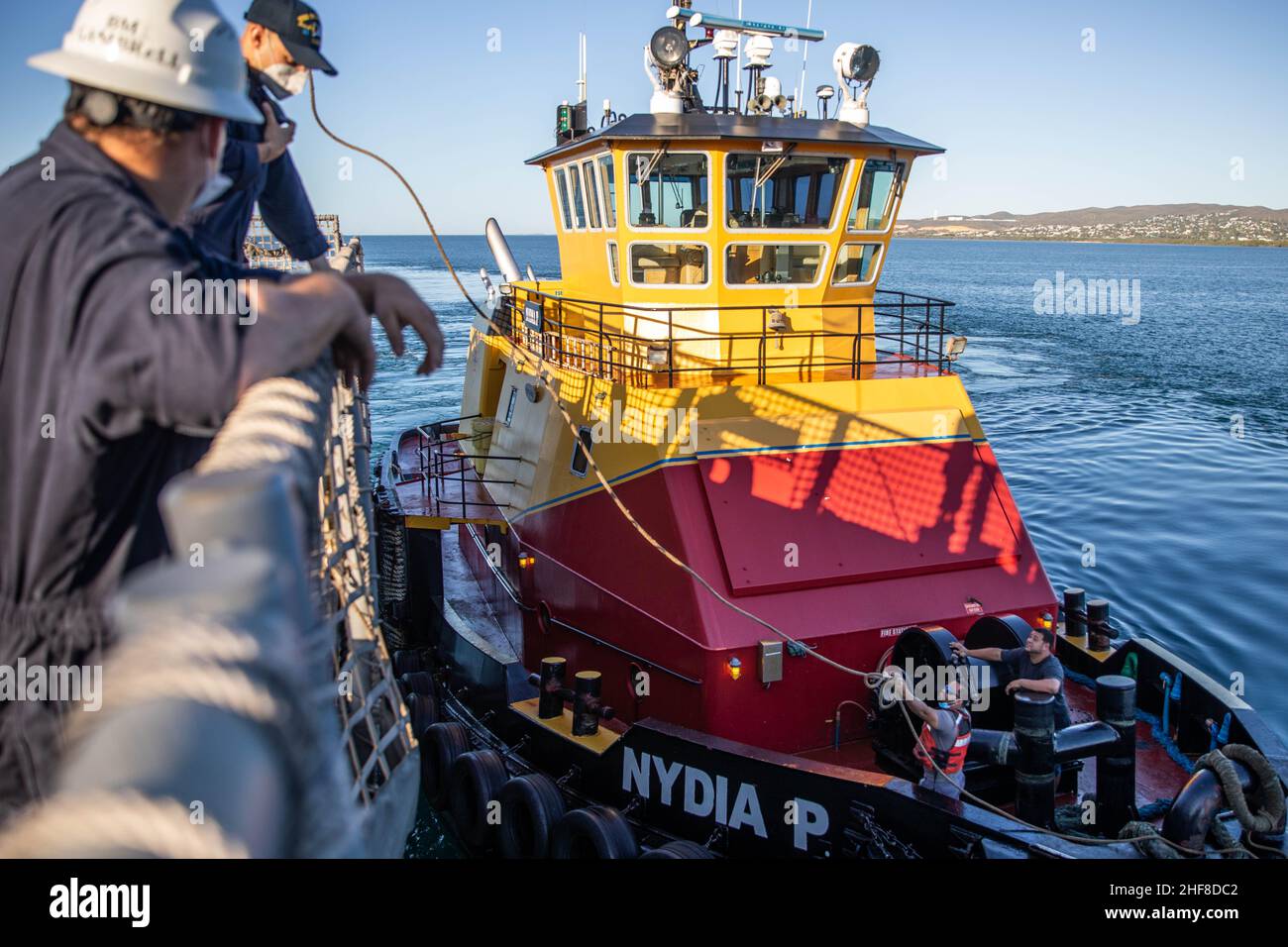 Puerto Rico. 12th Jan, 2022. Sailors observe the crew on a tugboat ...
