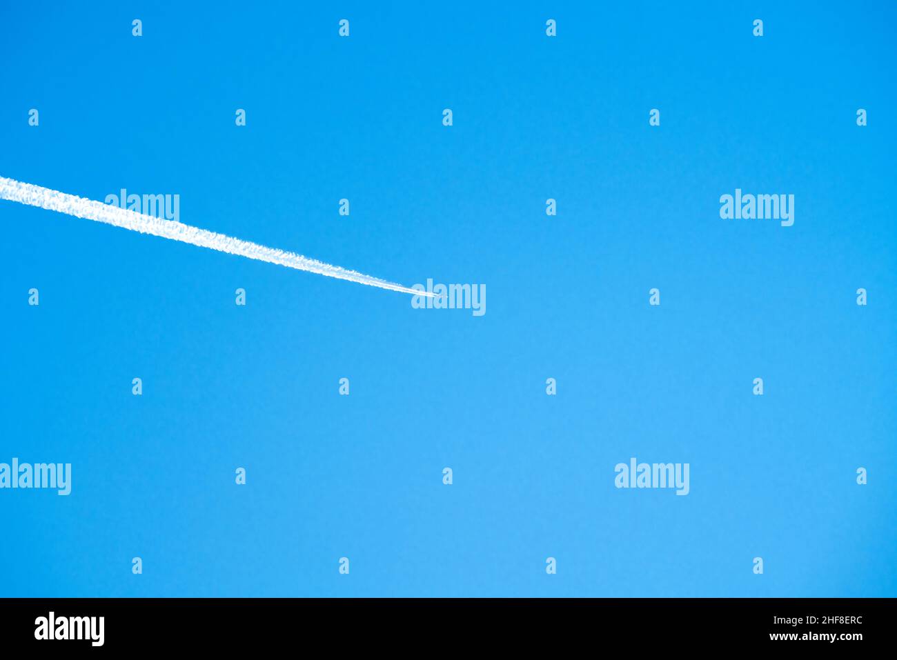 high altitude contrails from a KLM Boeing 787-10 dreamliner heading ...