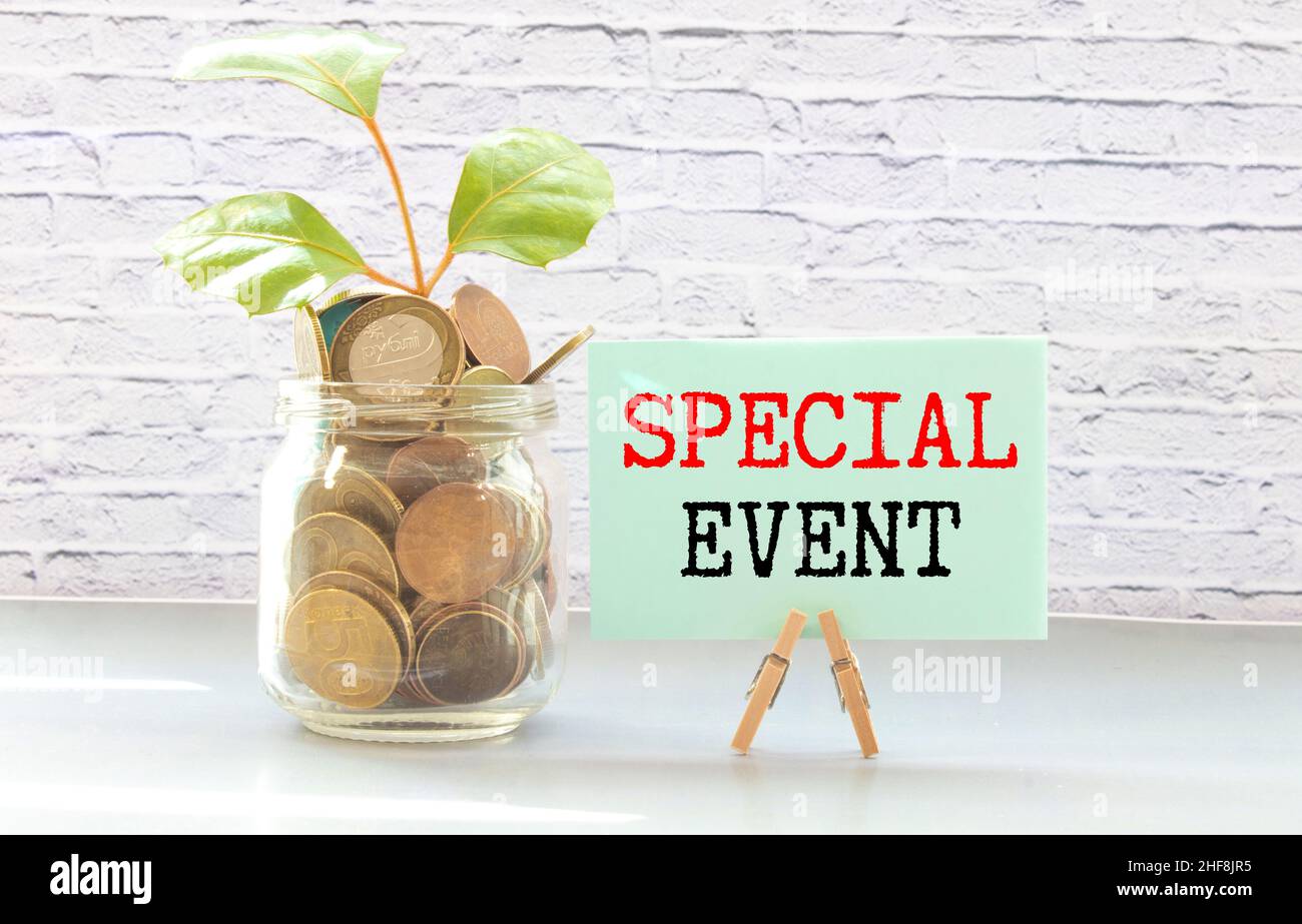 SPECIAL EVENT text on the notebook with office supplies on white ...