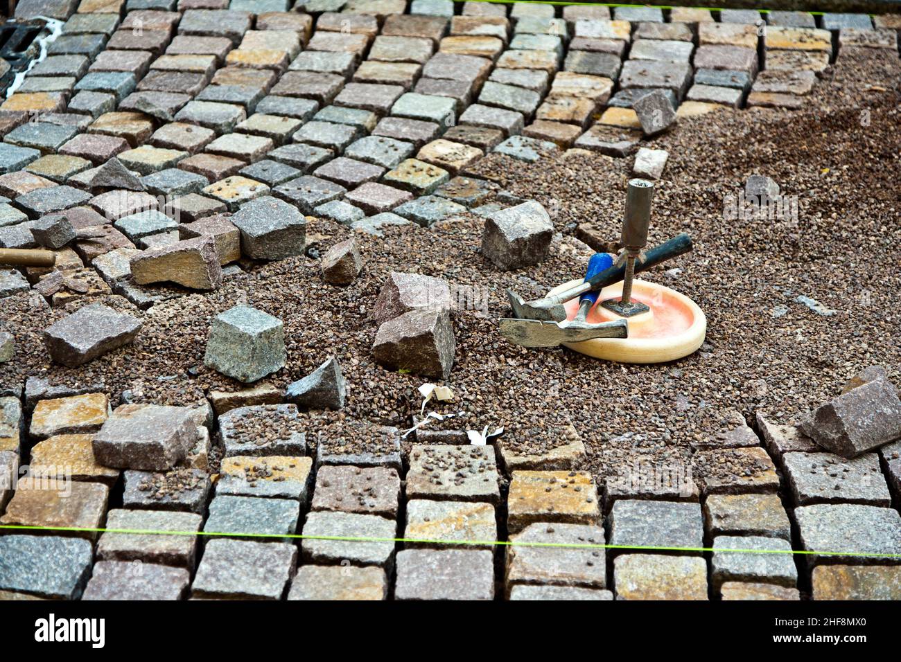 way of cobble stone under construction with tool Stock Photo - Alamy