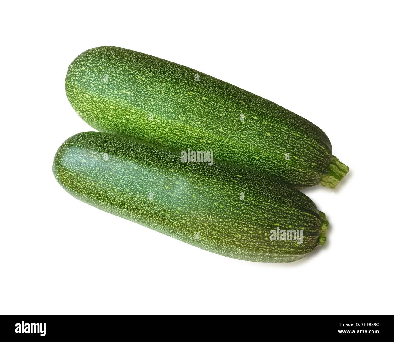 Two zucchini isolated on white background Stock Photo - Alamy