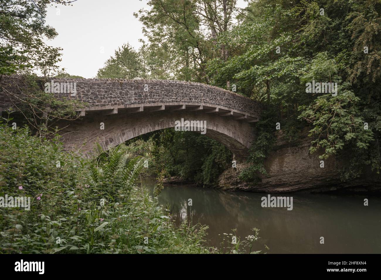 11 June 2021: The Bow Bridge over the River Teme in Downton Gorge ...