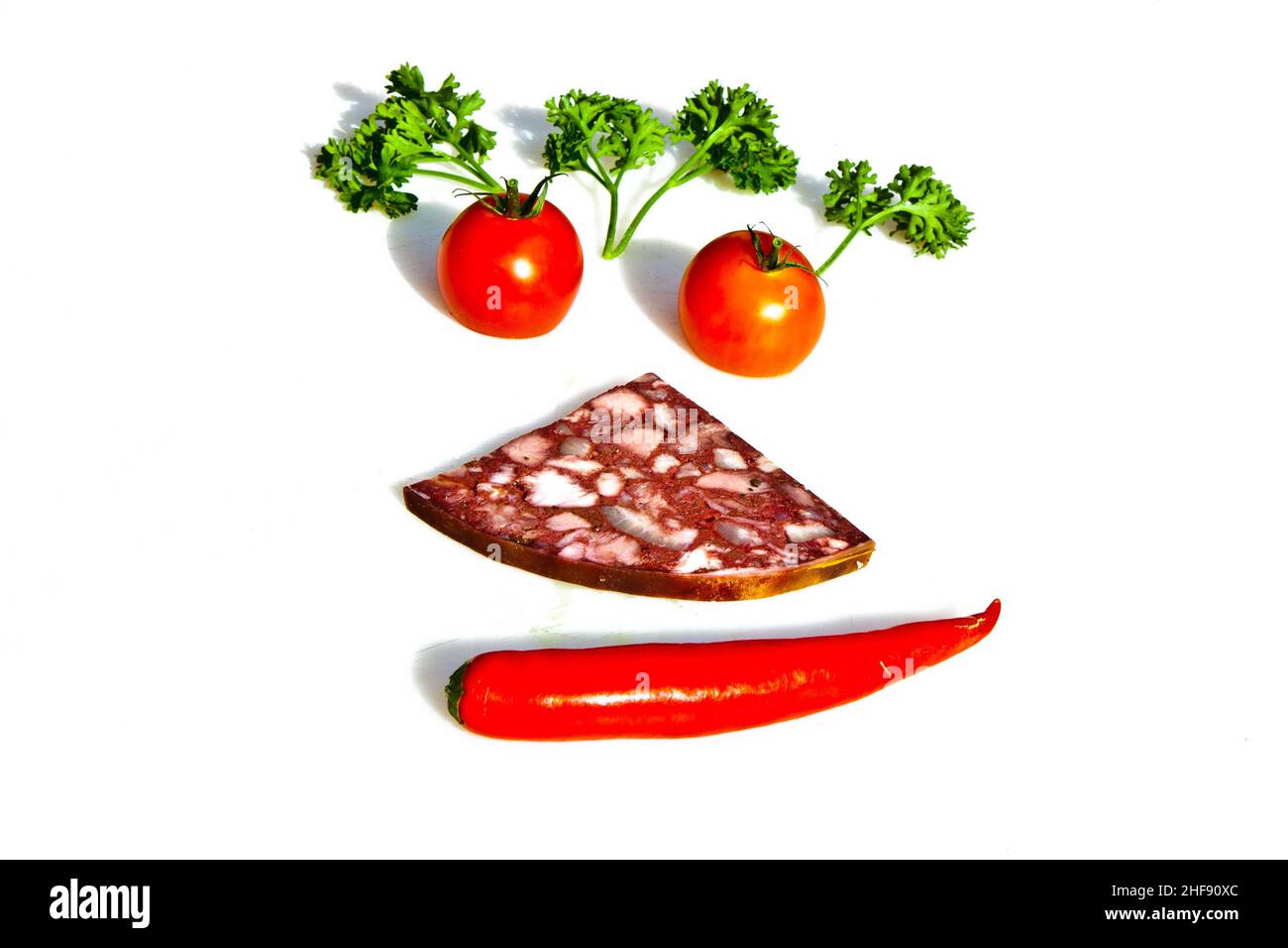 smiling face formed by meat and vegetables Stock Photo - Alamy